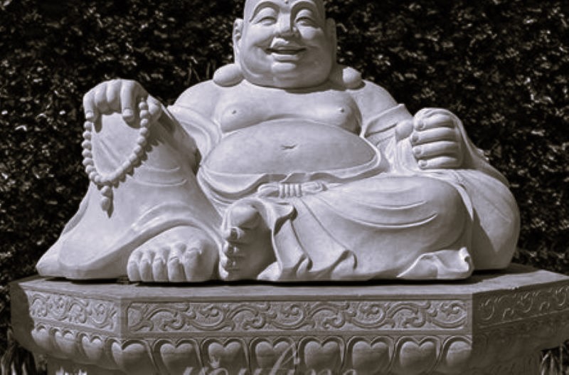 History of the Laughing Buddha: Origins and Meaning